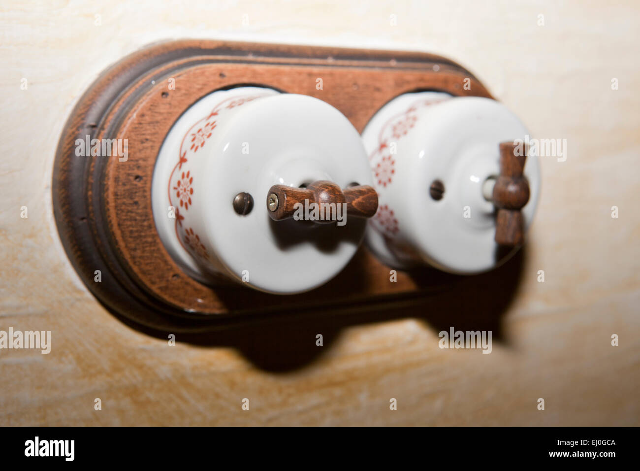 Ancient style double light switch made of porcelain and wood Stock ...