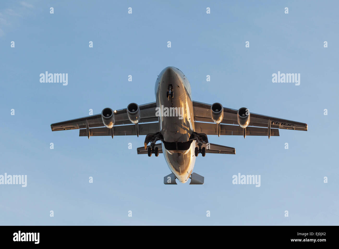 A plane landing, seen from below Stock Photo - Alamy