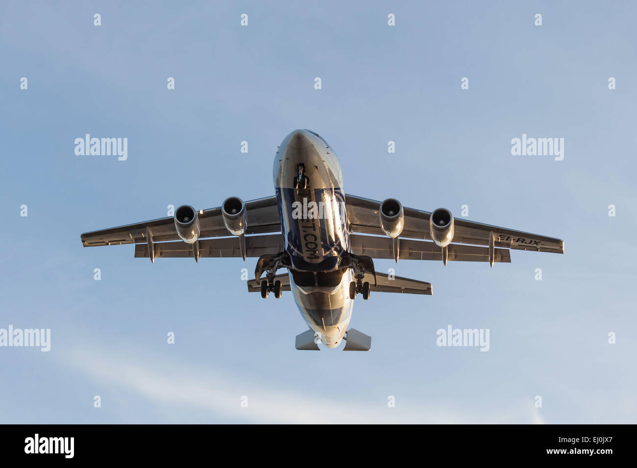 A plane landing, seen from below Stock Photo - Alamy