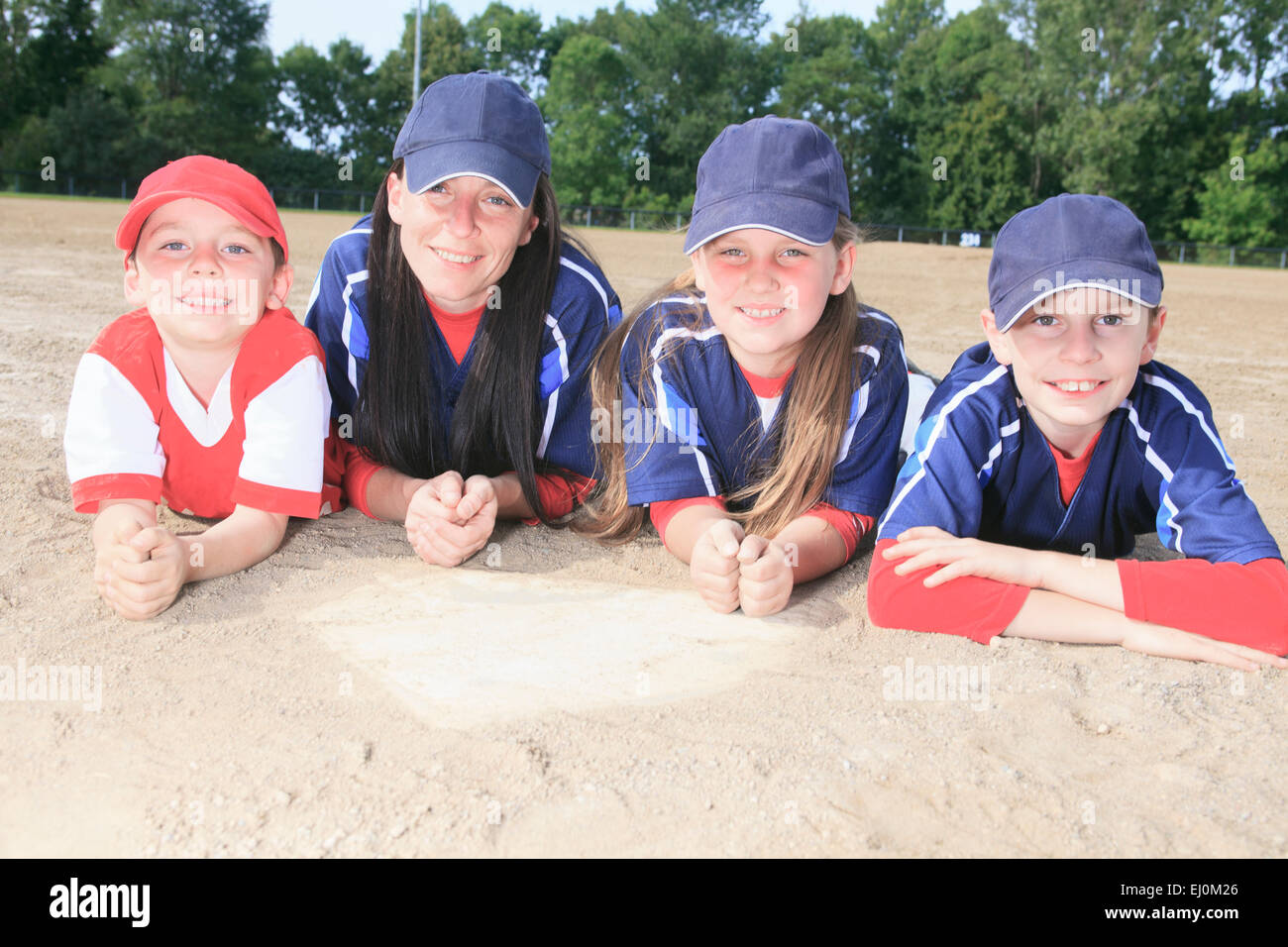 A Baseball team lay on the ground Stock Photo - Alamy