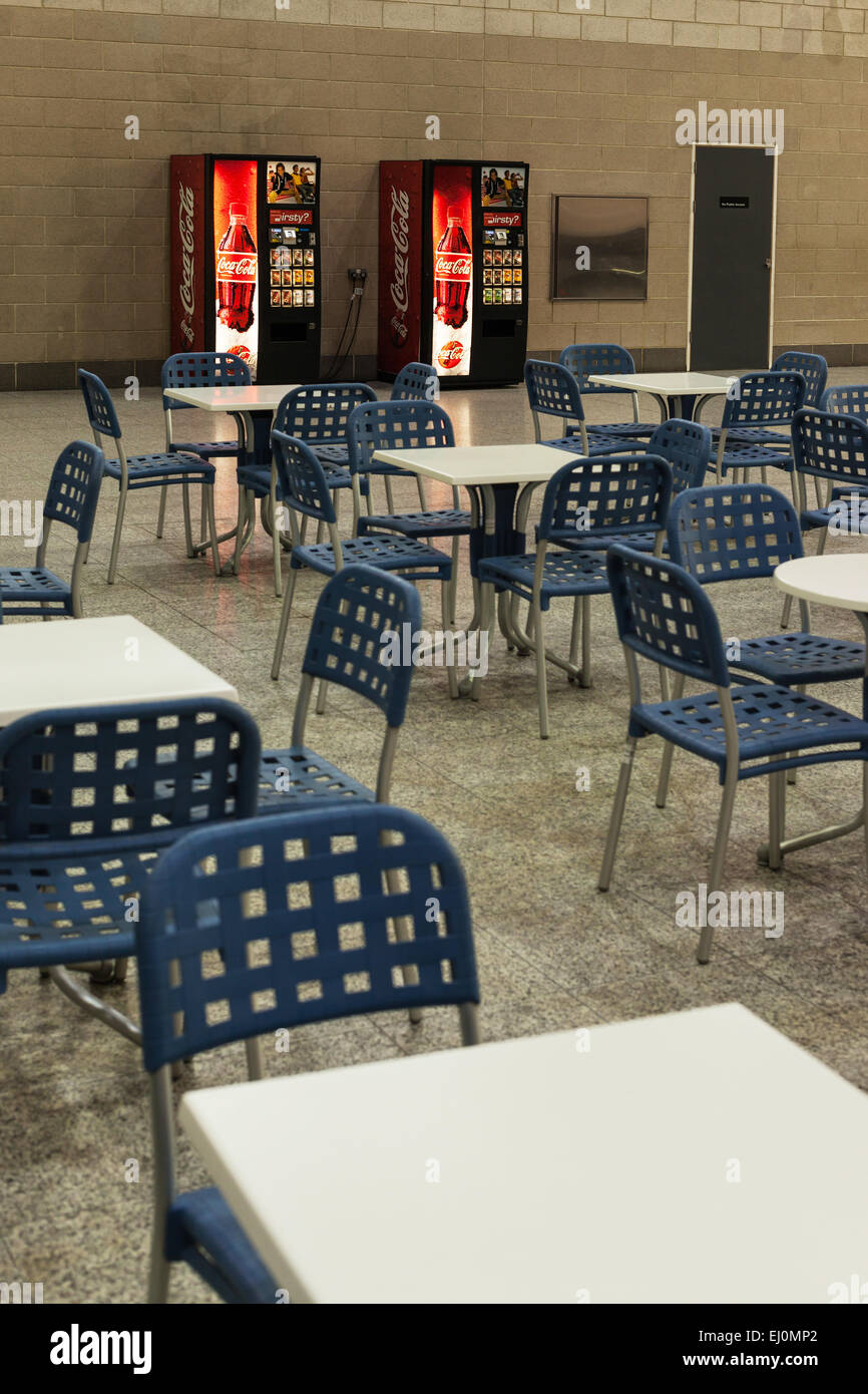 Empty chairs and tables and drink machines Stock Photo - Alamy