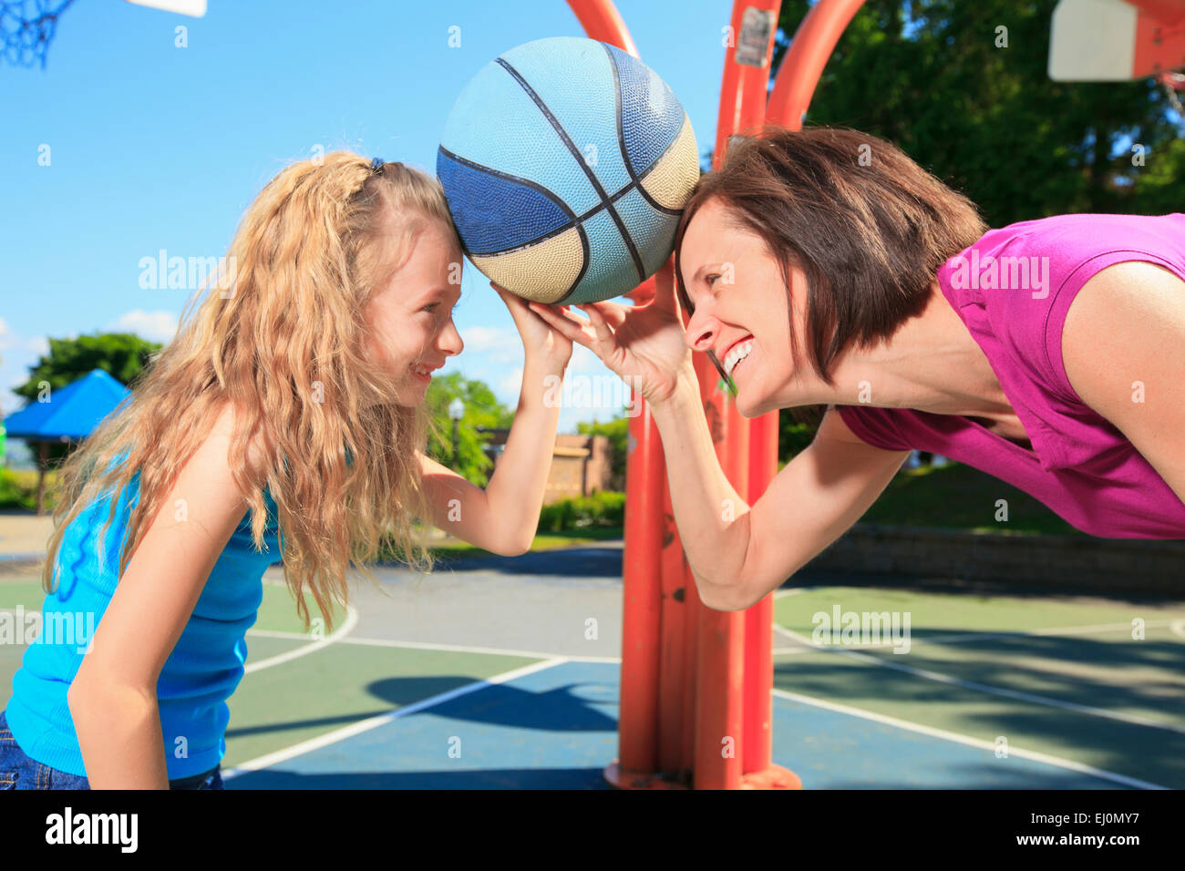 A mother play basketball with his daughter Stock Photo - Alamy