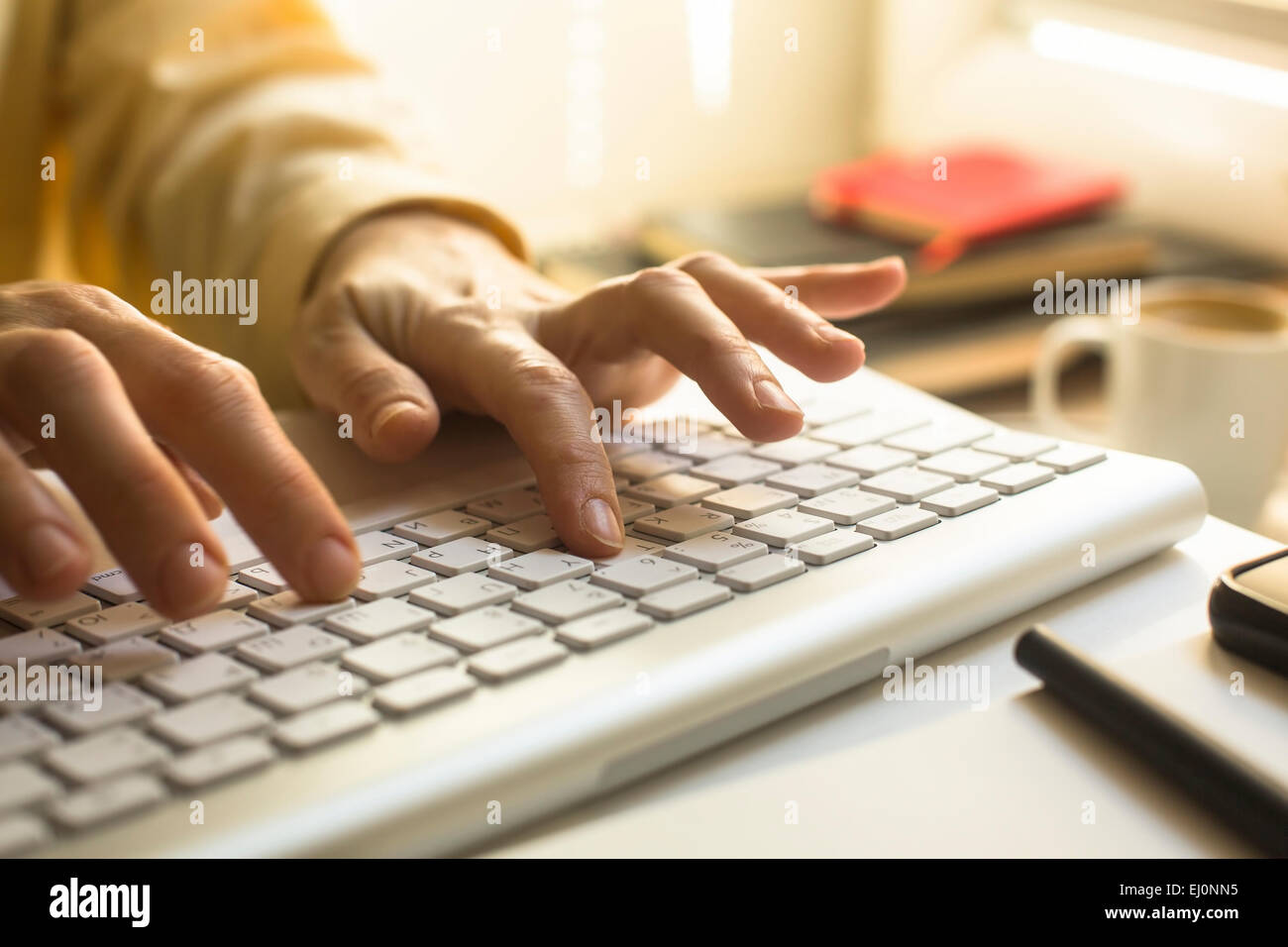 Women's fingers typing on laptop keyboard close-up Stock Photo - Alamy