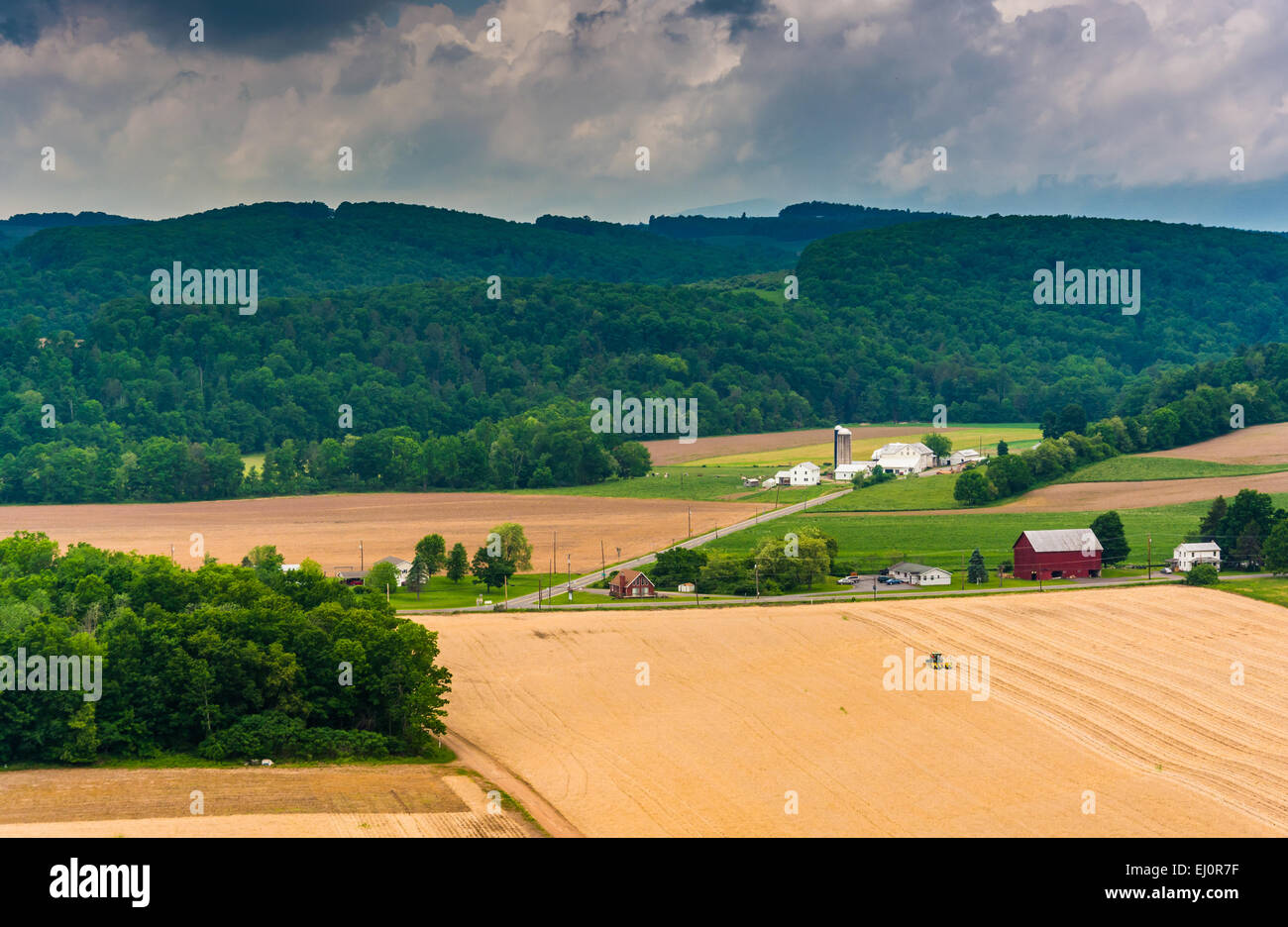View of farm fields and distant mountains from a roadside overlook near ...