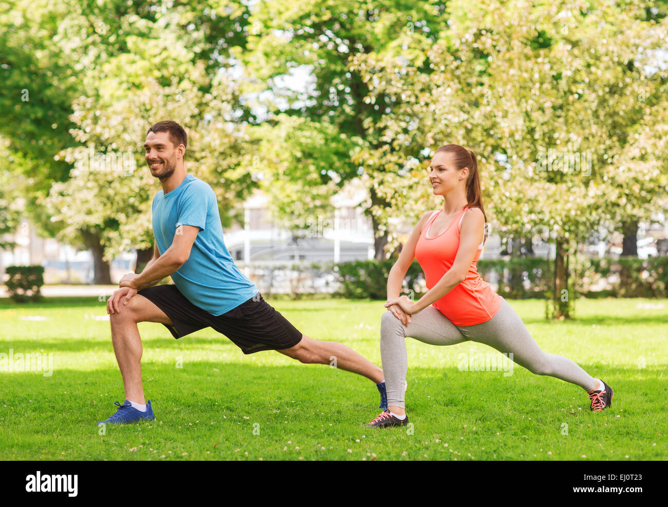 Man woman stretching legs together hi-res stock photography and images ...