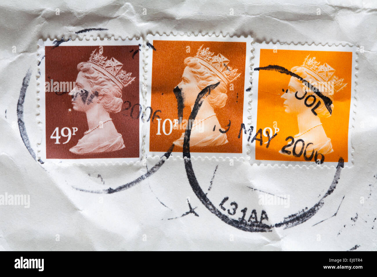 Postage Stamps on package with the value of 49p 10p and 9p Stock Photo ...