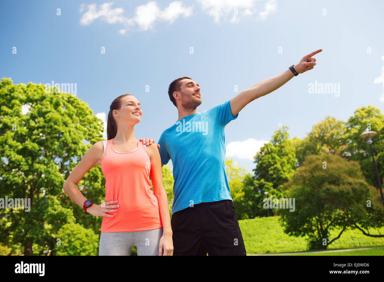 two smiling people outdoors Stock Photo - Alamy
