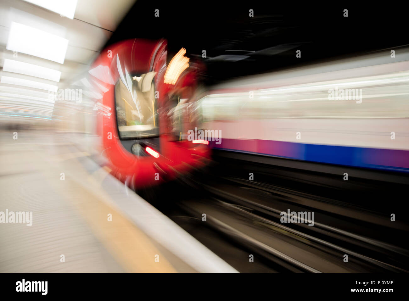 Tube train in motion Stock Photo - Alamy