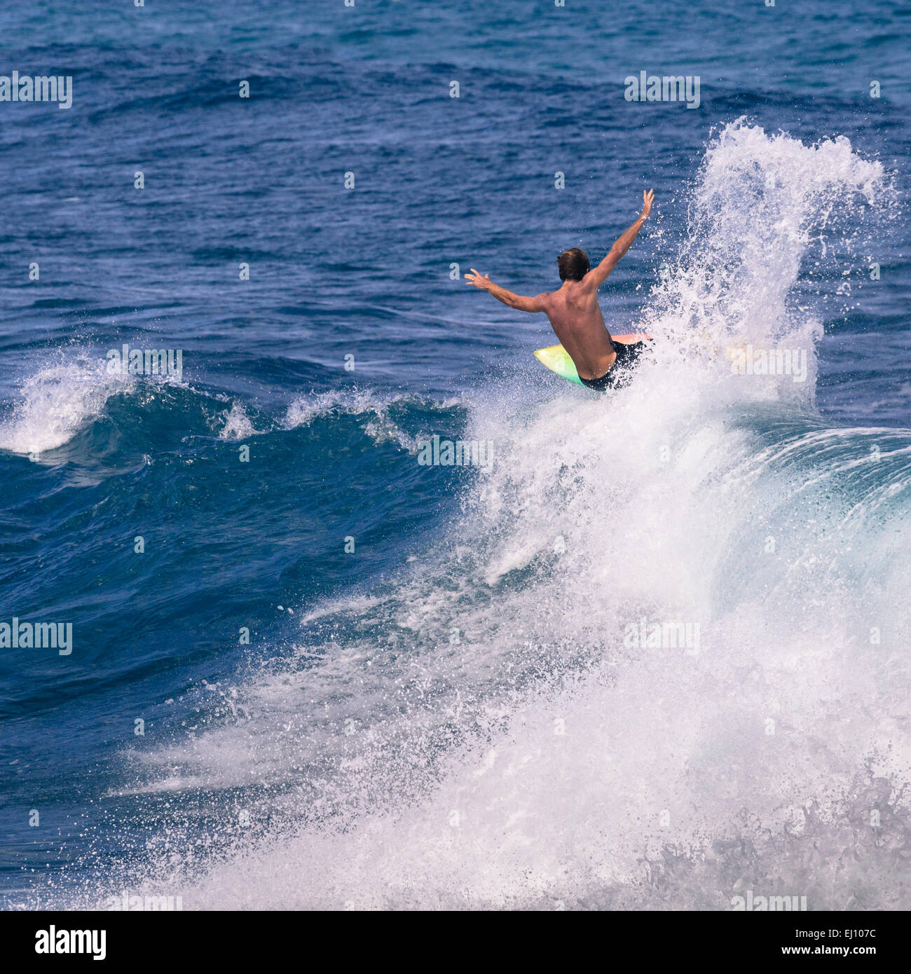 Extreme surfer riding giant ocean wave in Hawaii Stock Photo - Alamy