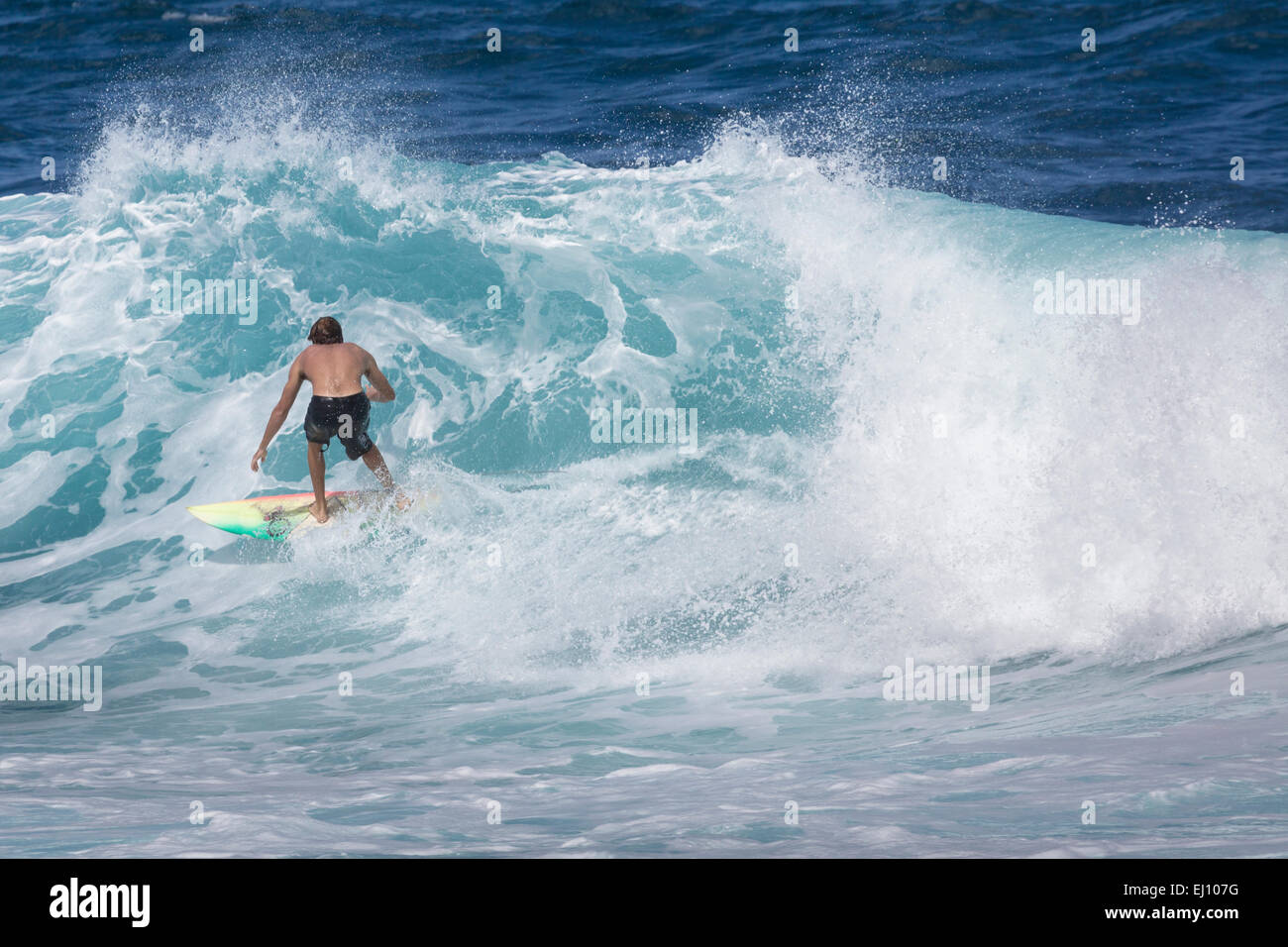 Extreme surfer riding giant ocean wave in Hawaii Stock Photo - Alamy