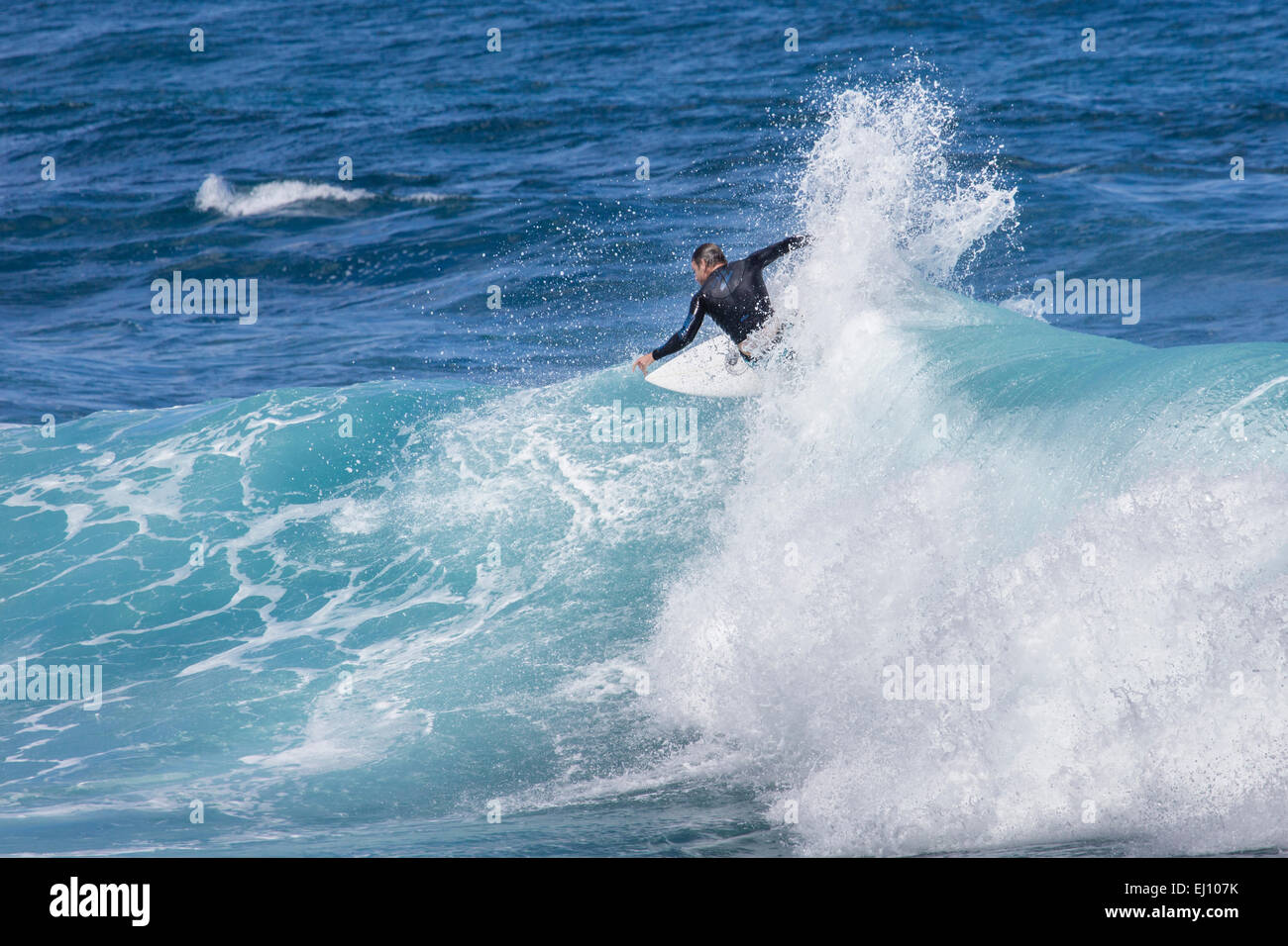 Extreme surfer riding giant ocean wave in Hawaii Stock Photo - Alamy