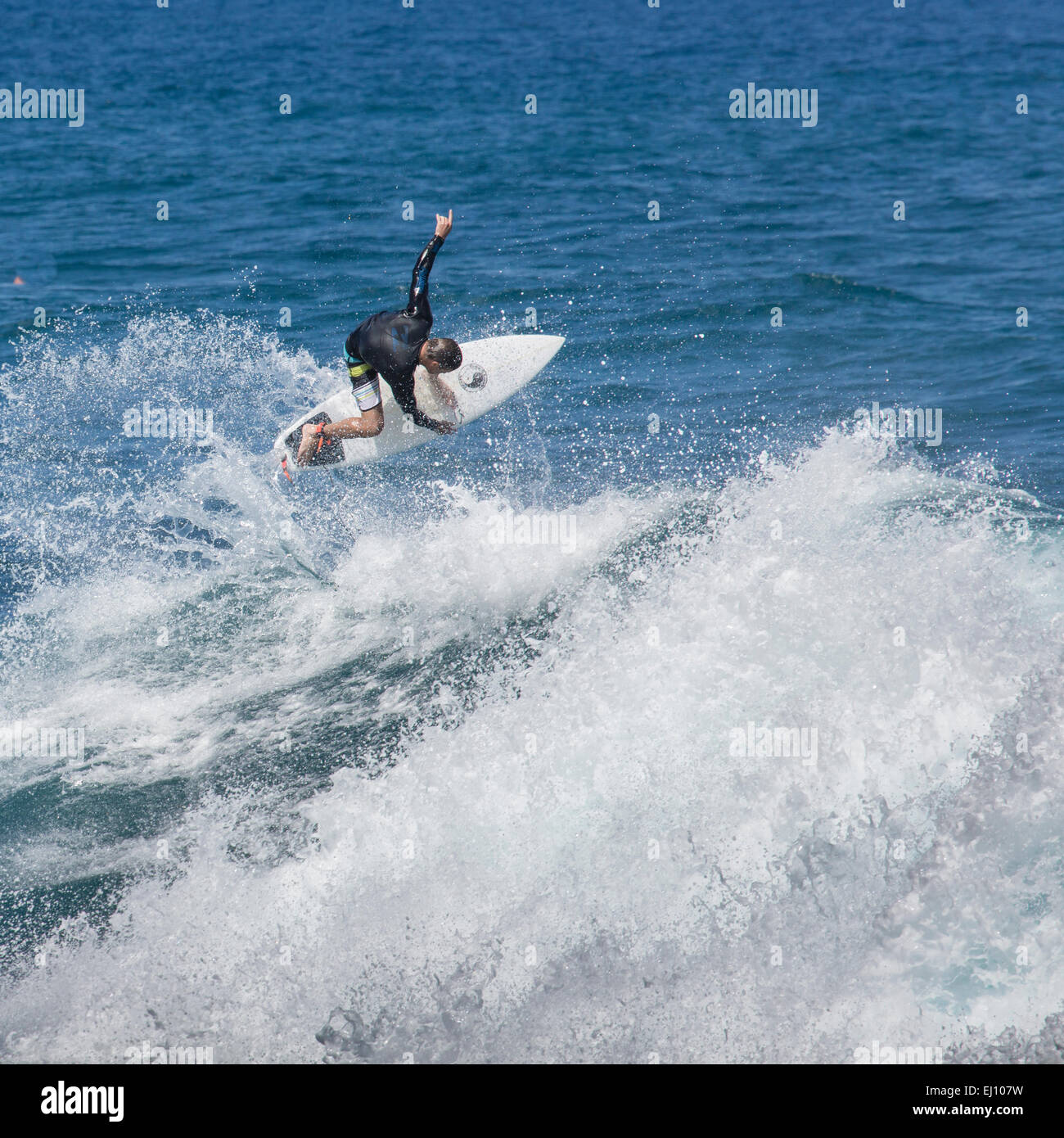 Extreme surfer riding giant ocean wave in Hawaii Stock Photo - Alamy