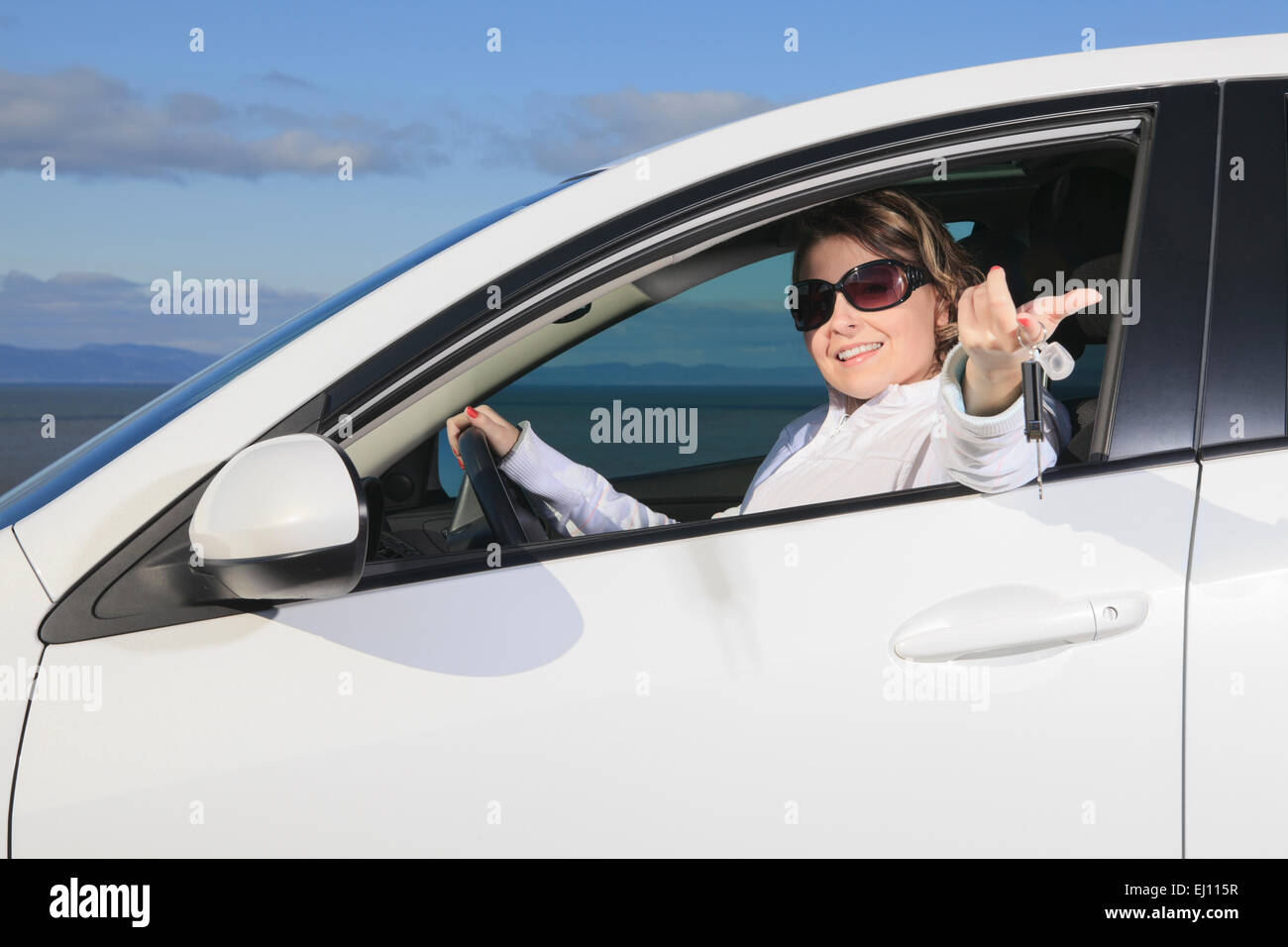 Car. Woman driver happy smiling Stock Photo - Alamy