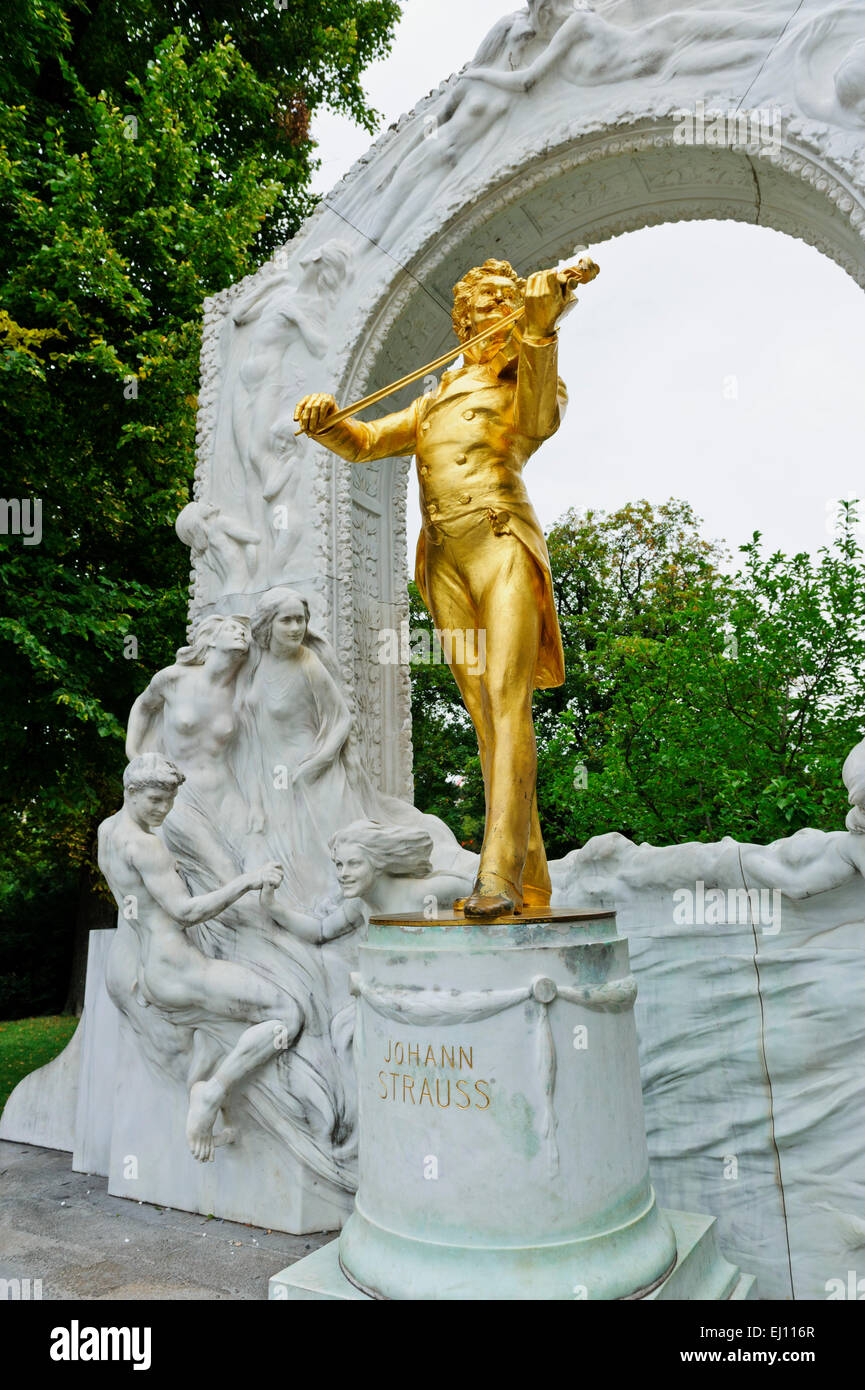 A golden coloured statue of Johann Strauss playing a violin, Vienna ...