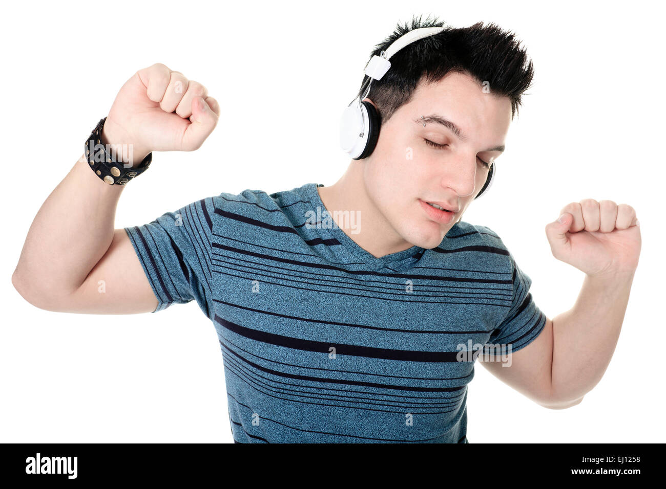 Portrait of a smiling male with headphones posing isolated on wh Stock ...