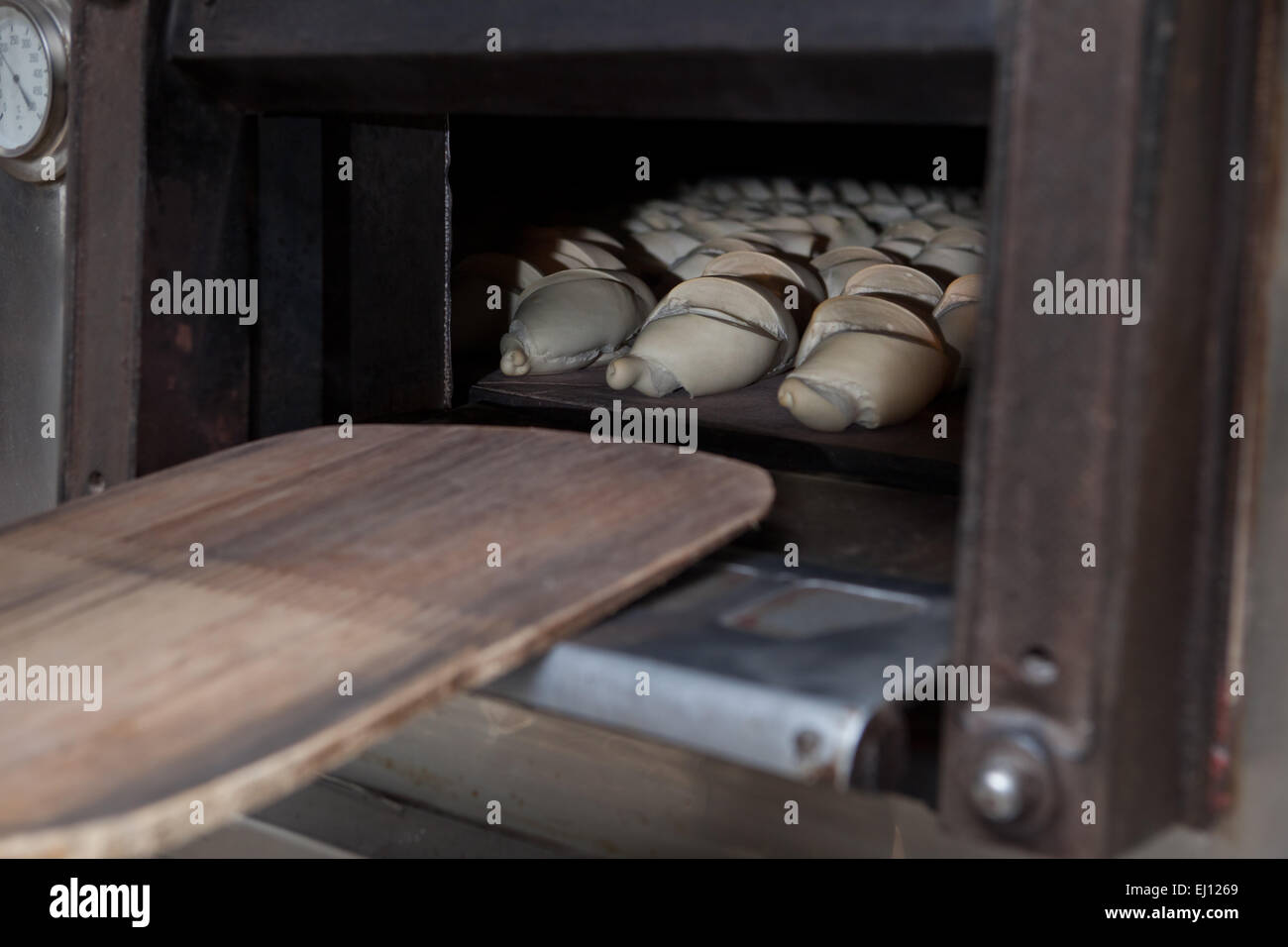 inside; interior; bread; fresh; done; baking peel; oven; door; wooden ...