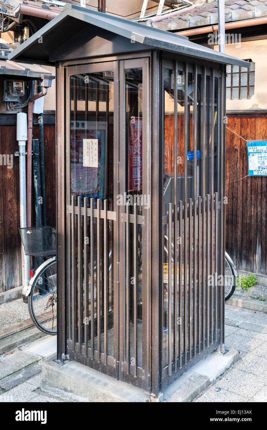 A wooden telephone kiosk or phonebox on a street in Kyoto, Japan Stock ...
