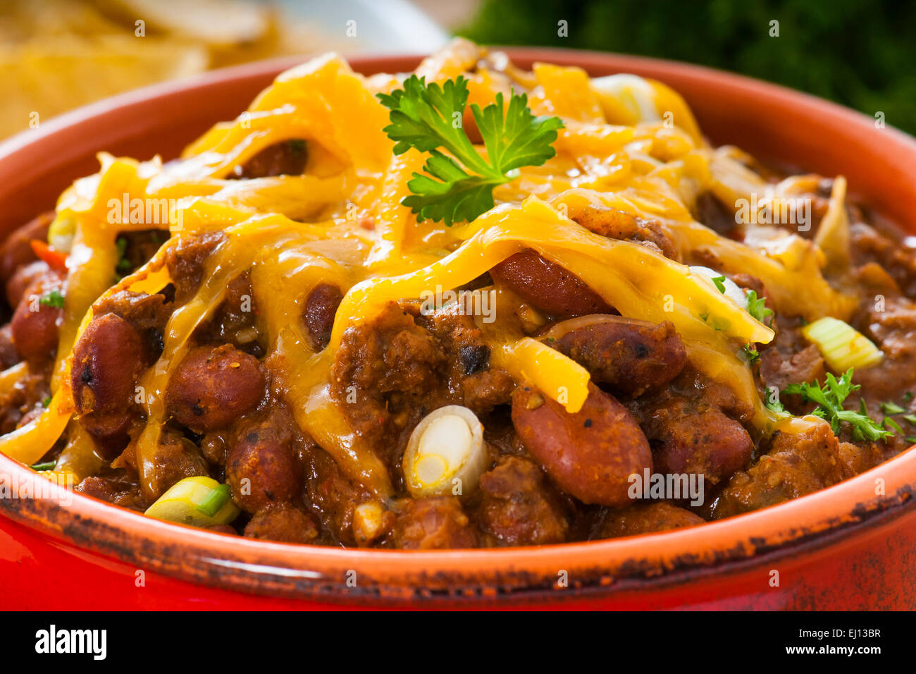 Beef and bean Mexican chili with nacho chips and cheddar cheese Stock ...