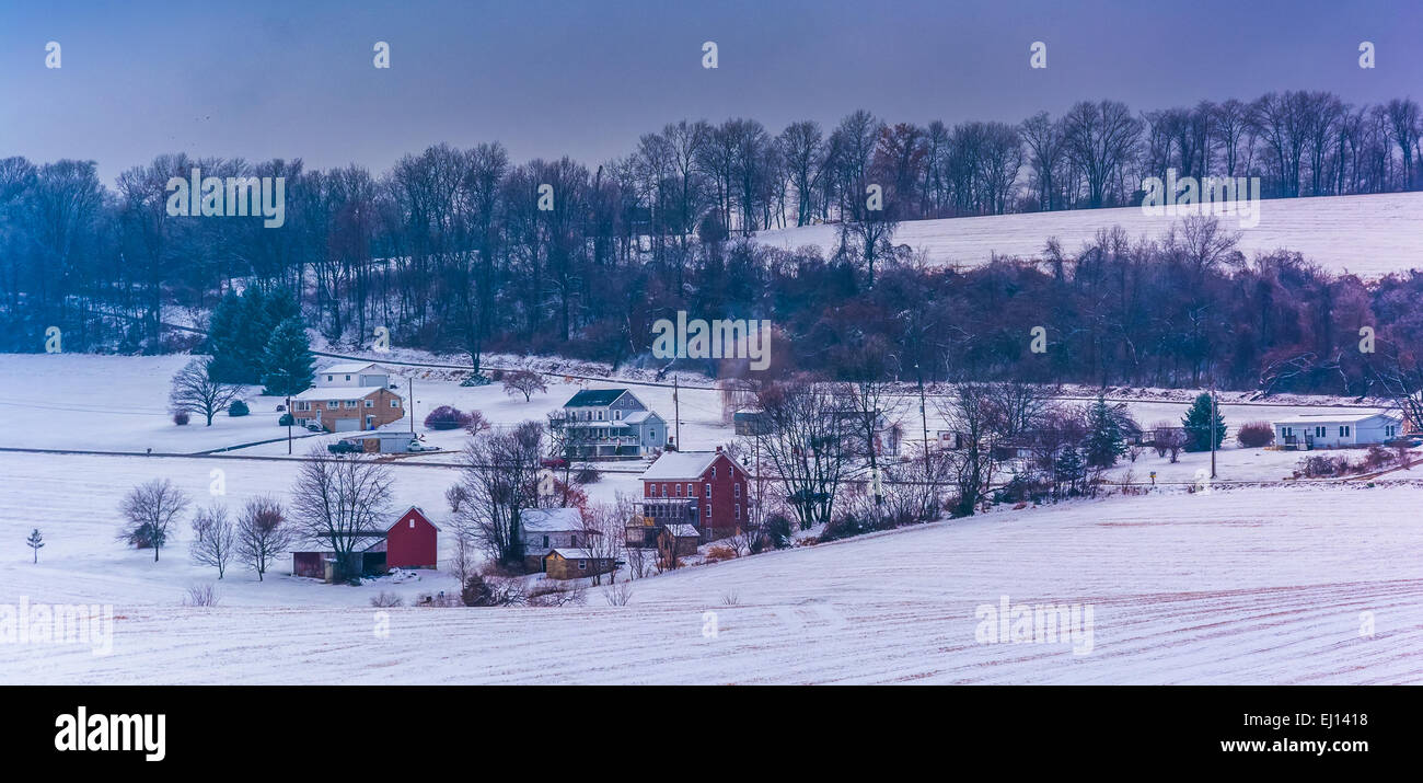 View of snow covered farm fields and houses in rural York County ...