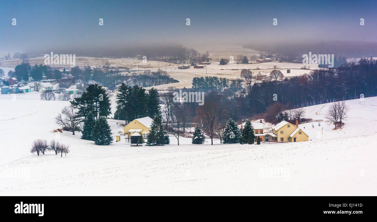 View of snow covered hills and fields in rural York County ...
