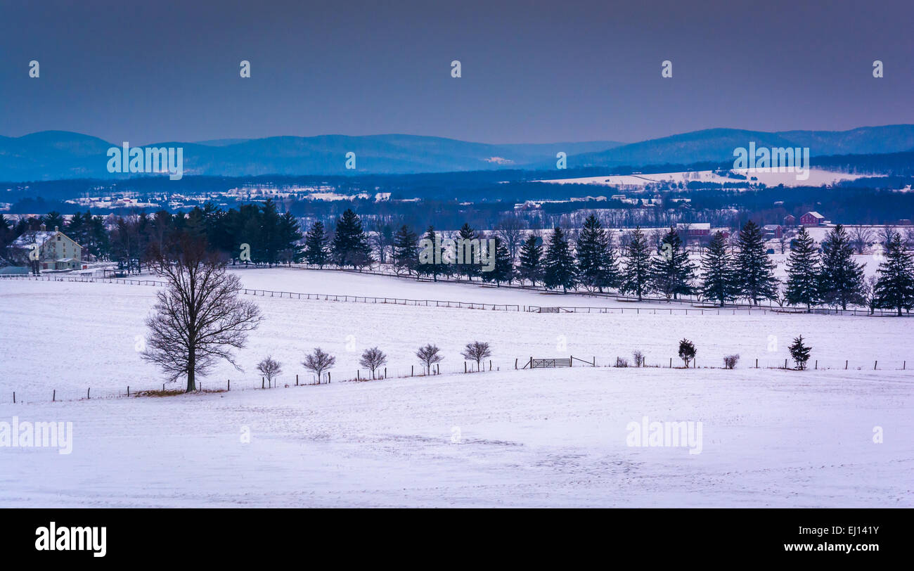 View of snow-covered farm fields and distant mountains from Longstreet ...
