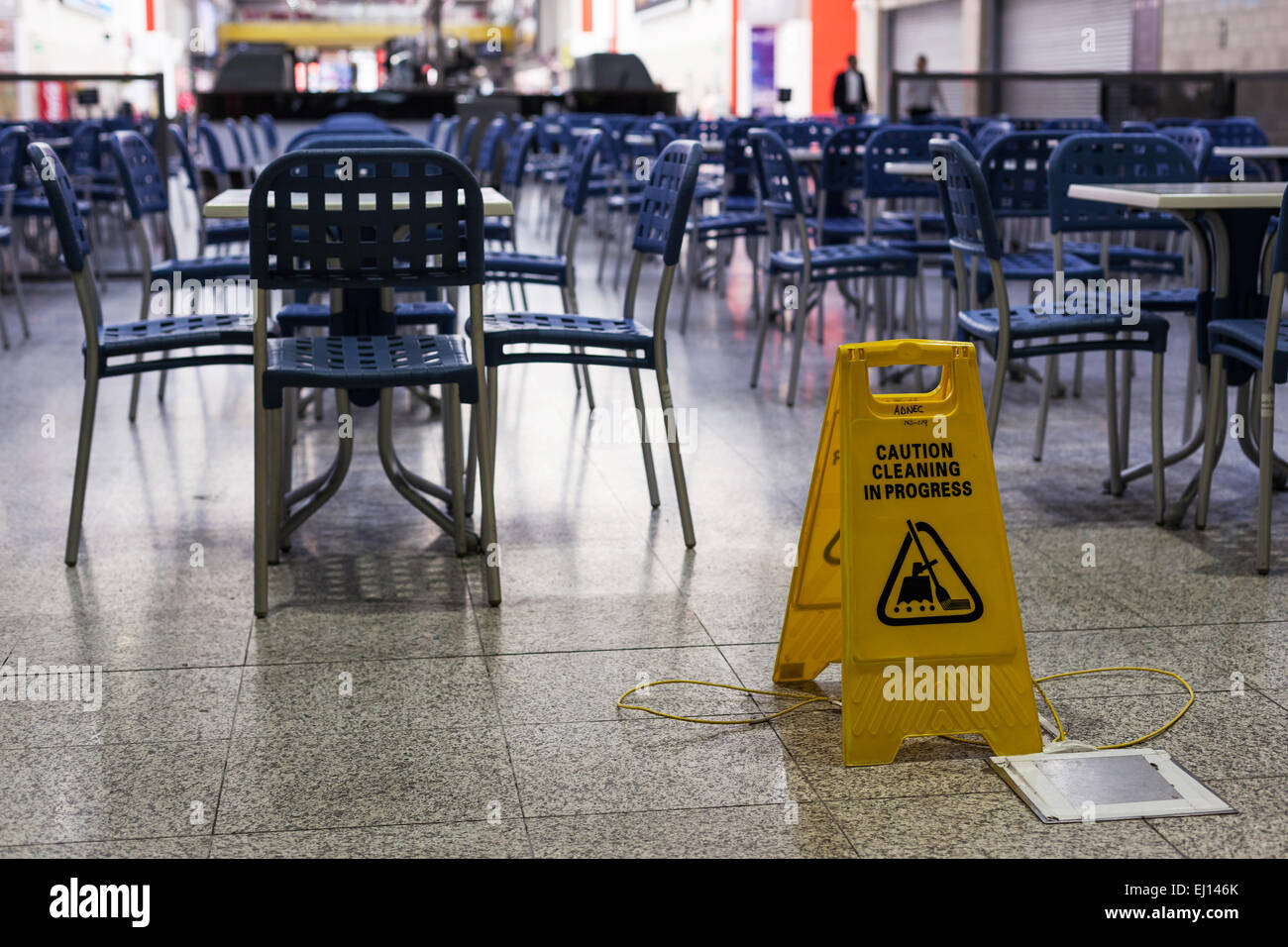 "Cleaning in Progress" sign with rows of chairs Stock Photo - Alamy