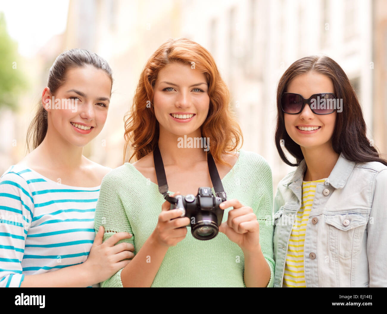 smiling teenage girls with camera Stock Photo - Alamy