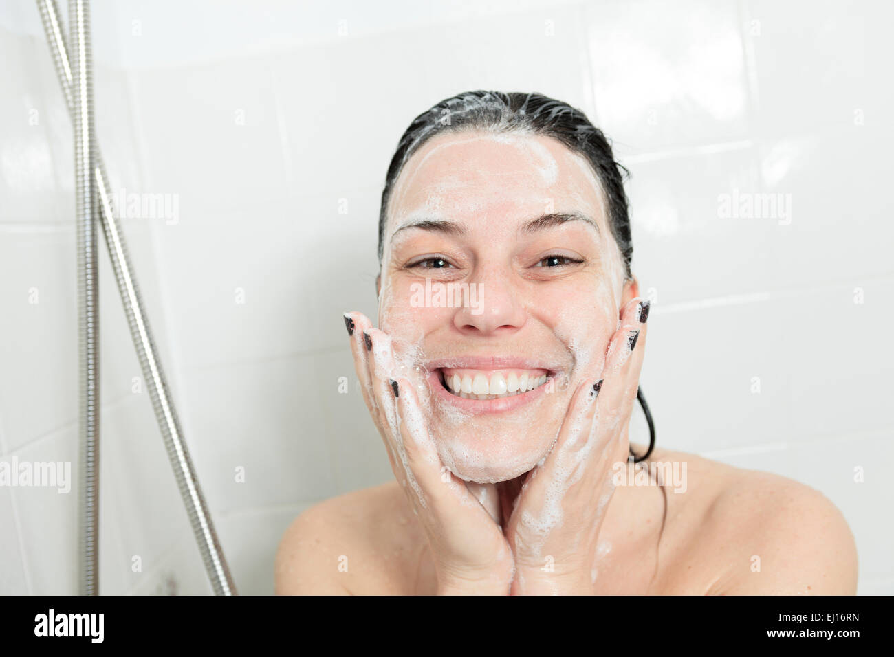 Shower woman. Happy smiling woman washing shoulder showering in Stock ...