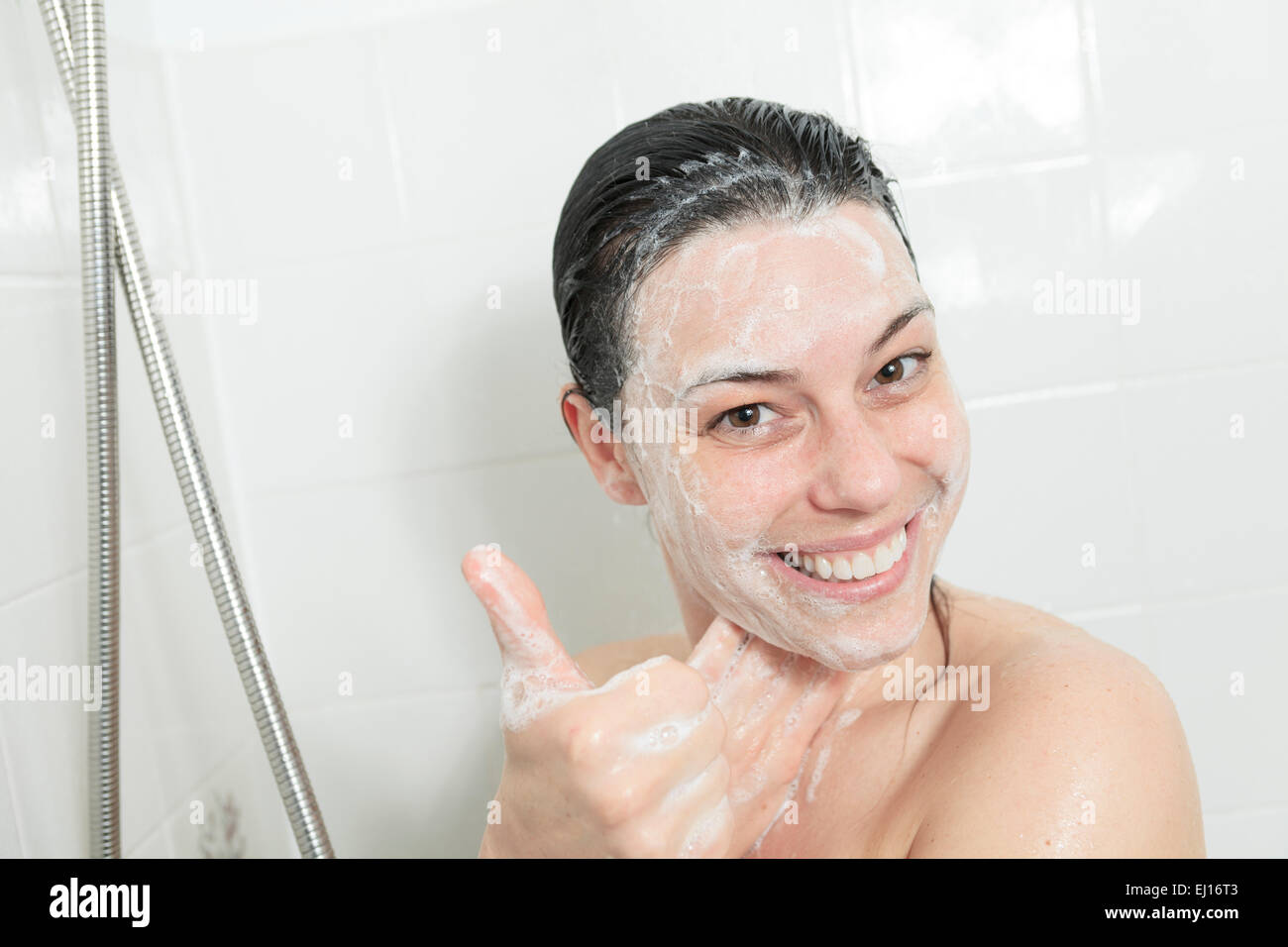 Shower woman. Happy smiling woman washing shoulder showering in Stock ...