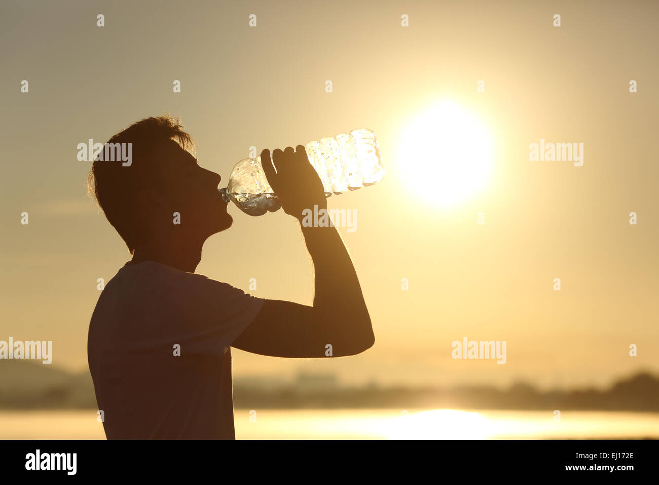 Silhouette man drinking water from hi-res stock photography and images ...