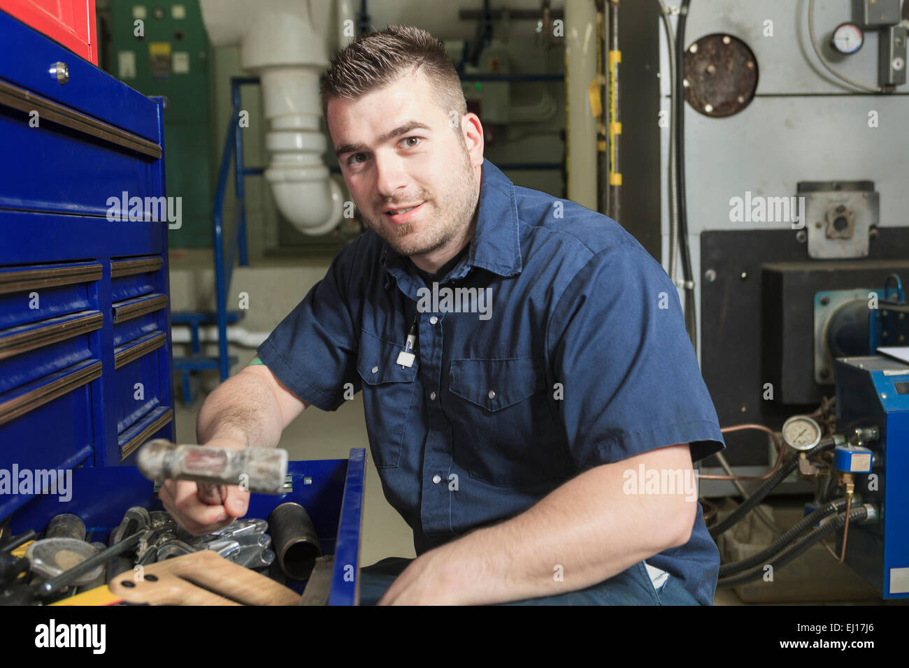 industrial technician inside a industrial place Stock Photo - Alamy