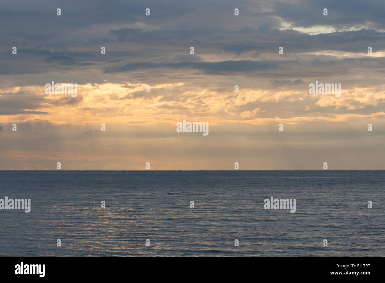 light rays falling through clouds on the Adriatic sea surface Stock ...