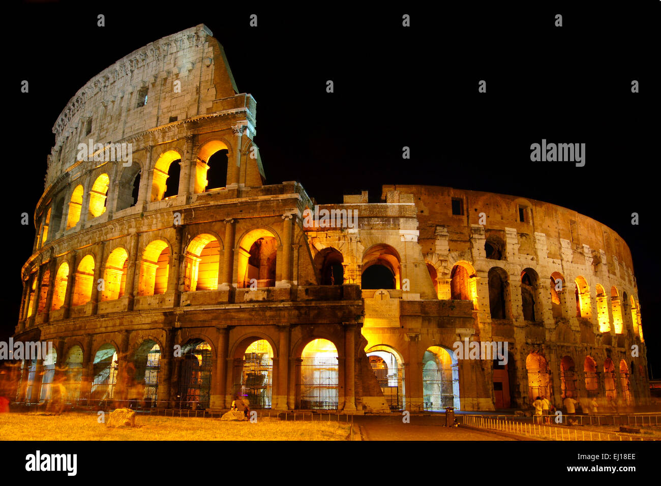 The Colosseum under the glow of lights at night, Rome, Italy Stock ...