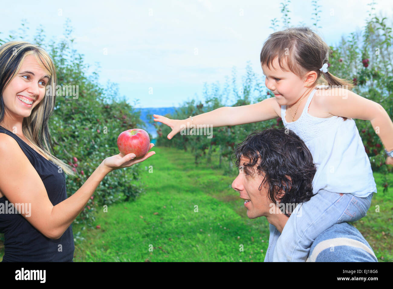 mother and her daughter with apple on her hand Stock Photo - Alamy
