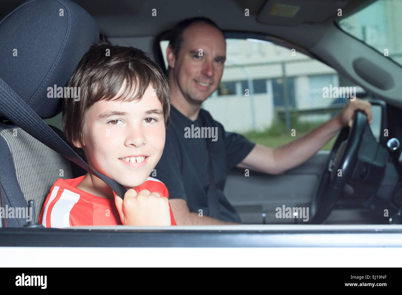 Portrait of smiling boy in the car of his father Stock Photo - Alamy