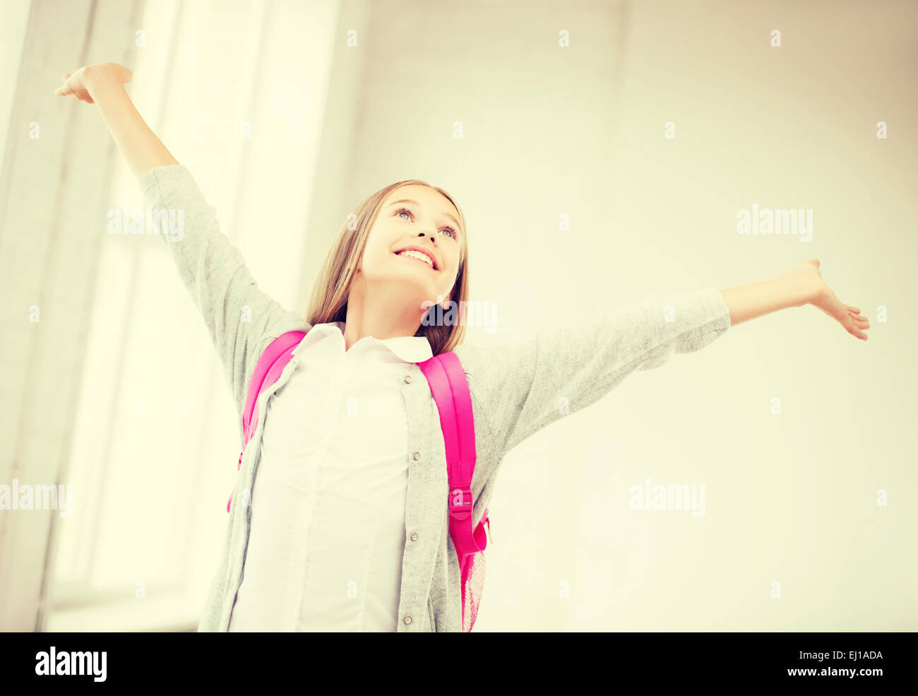happy teenage girl with raised hands Stock Photo - Alamy