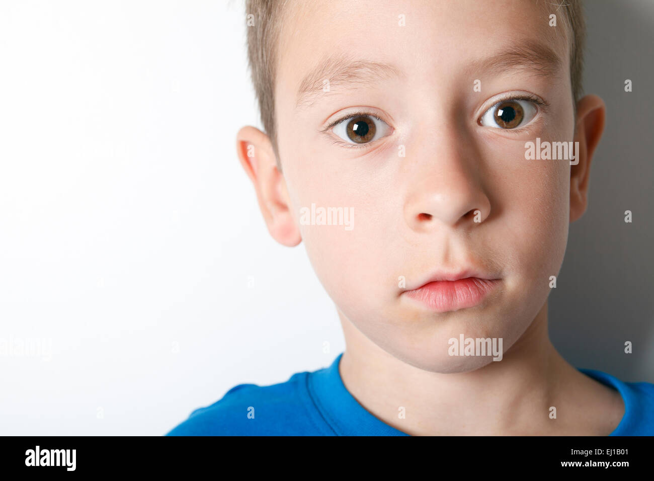 Photo of adorable young happy boy looking at camera Stock Photo - Alamy