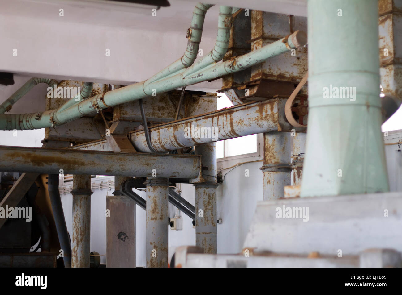 Interior pipes of an abandoned grain silo factory Stock Photo - Alamy