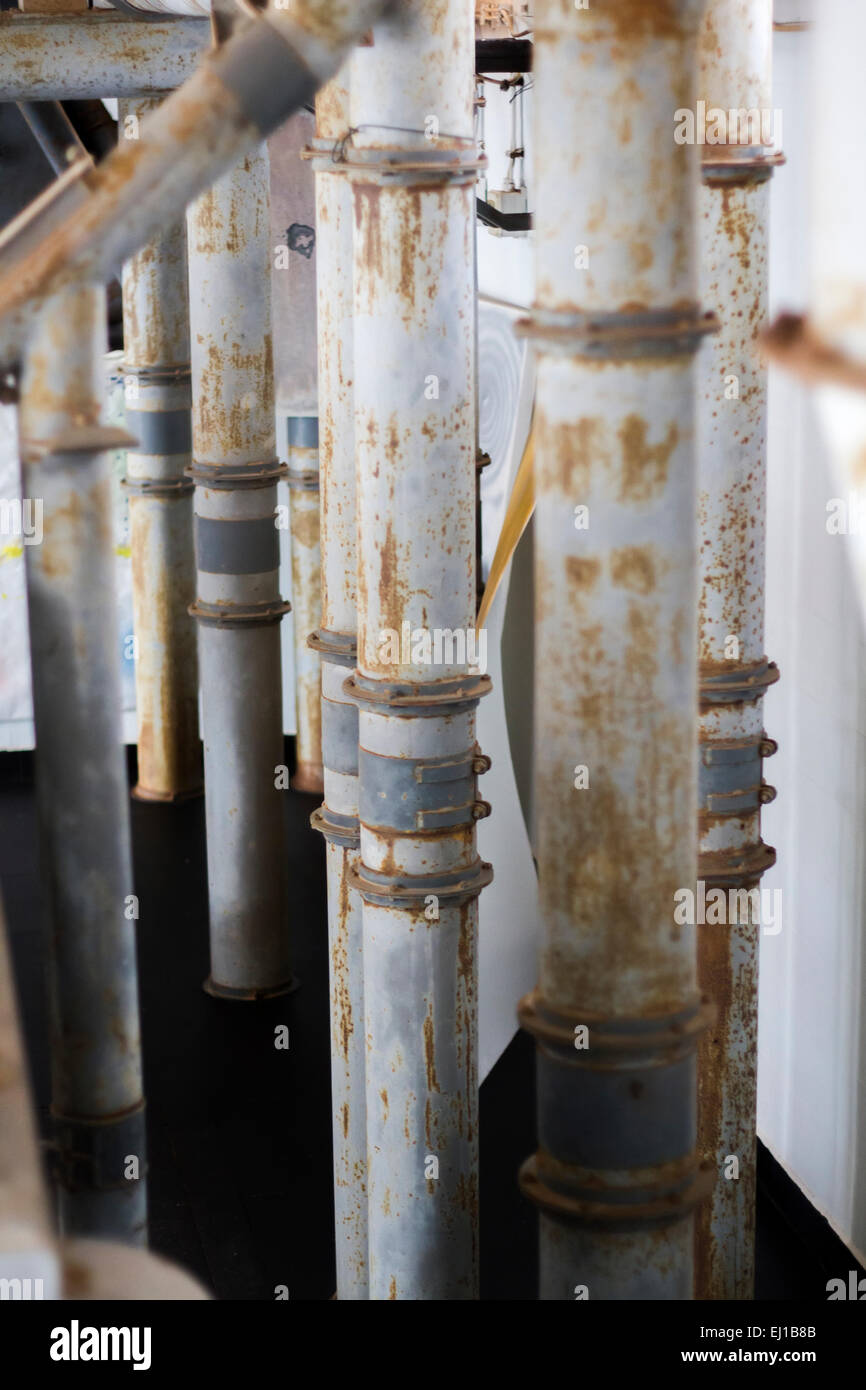 Interior pipes of an abandoned grain silo factory Stock Photo - Alamy