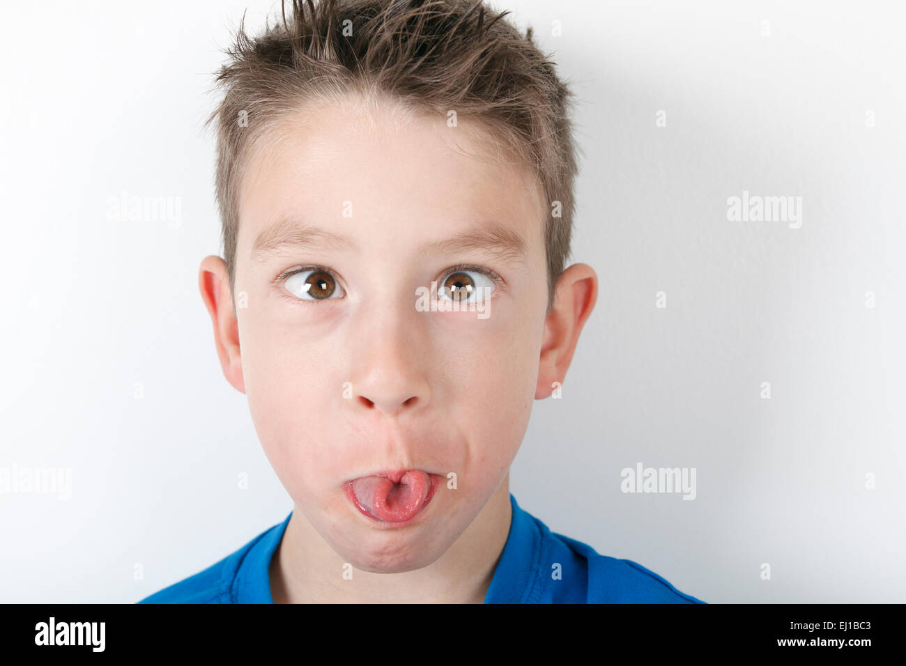 cute boy making funny face, isolated on white background. Studio Stock ...