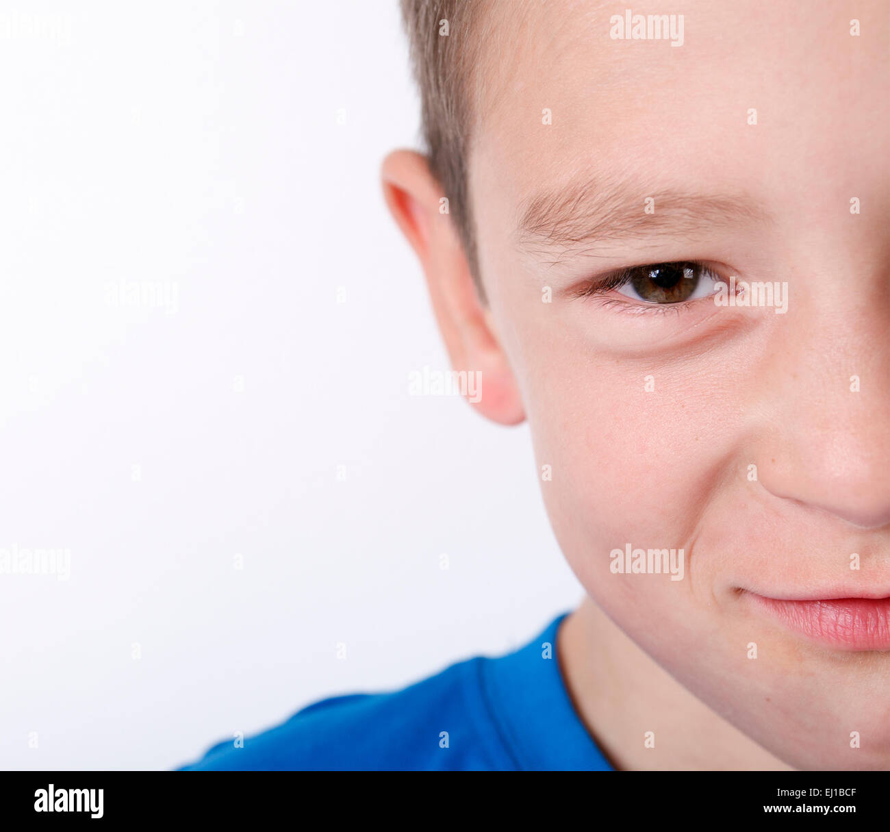 Photo of adorable young happy boy looking at camera Stock Photo - Alamy