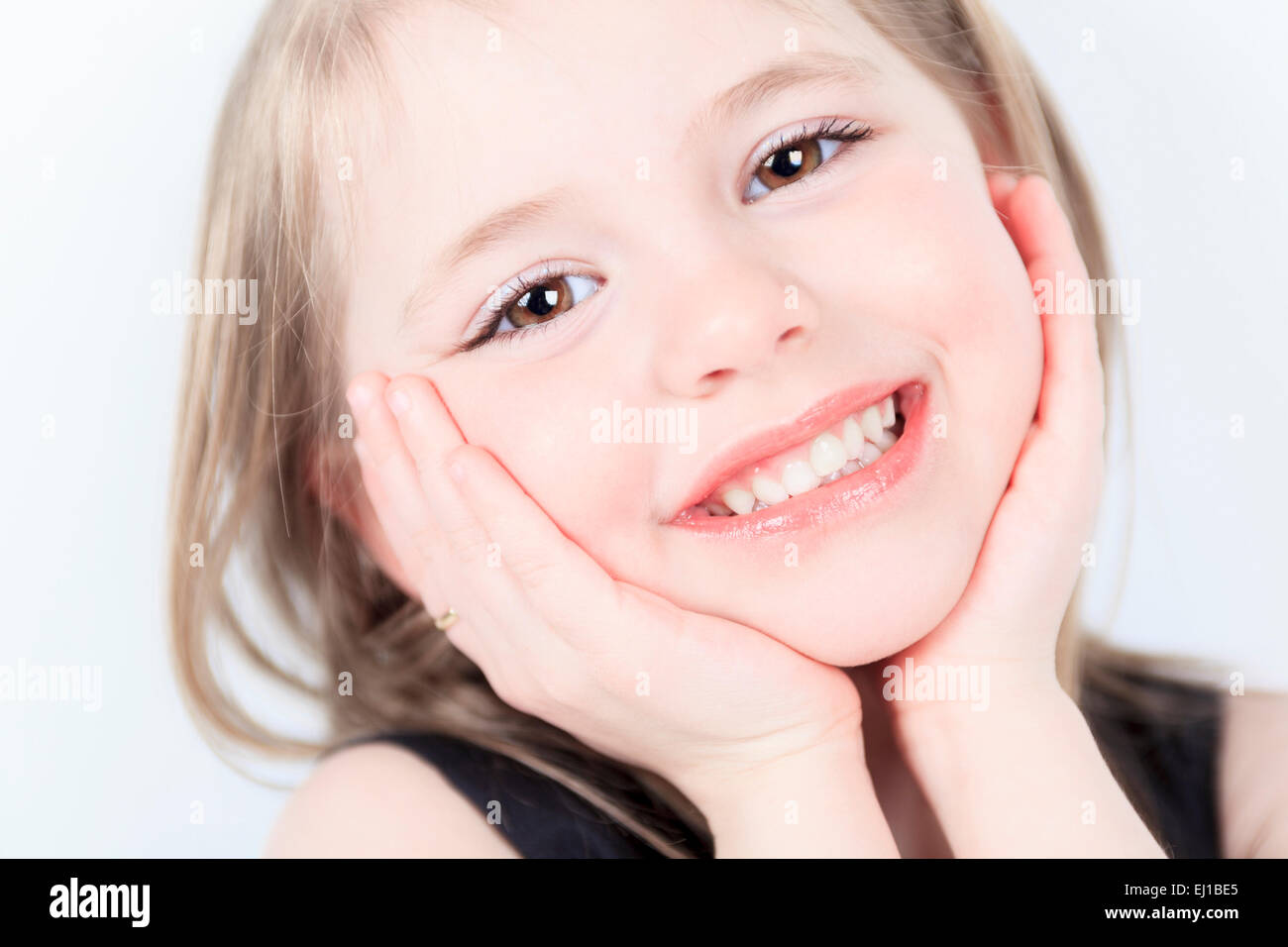 laugh a little girl at the studio shooting Stock Photo - Alamy
