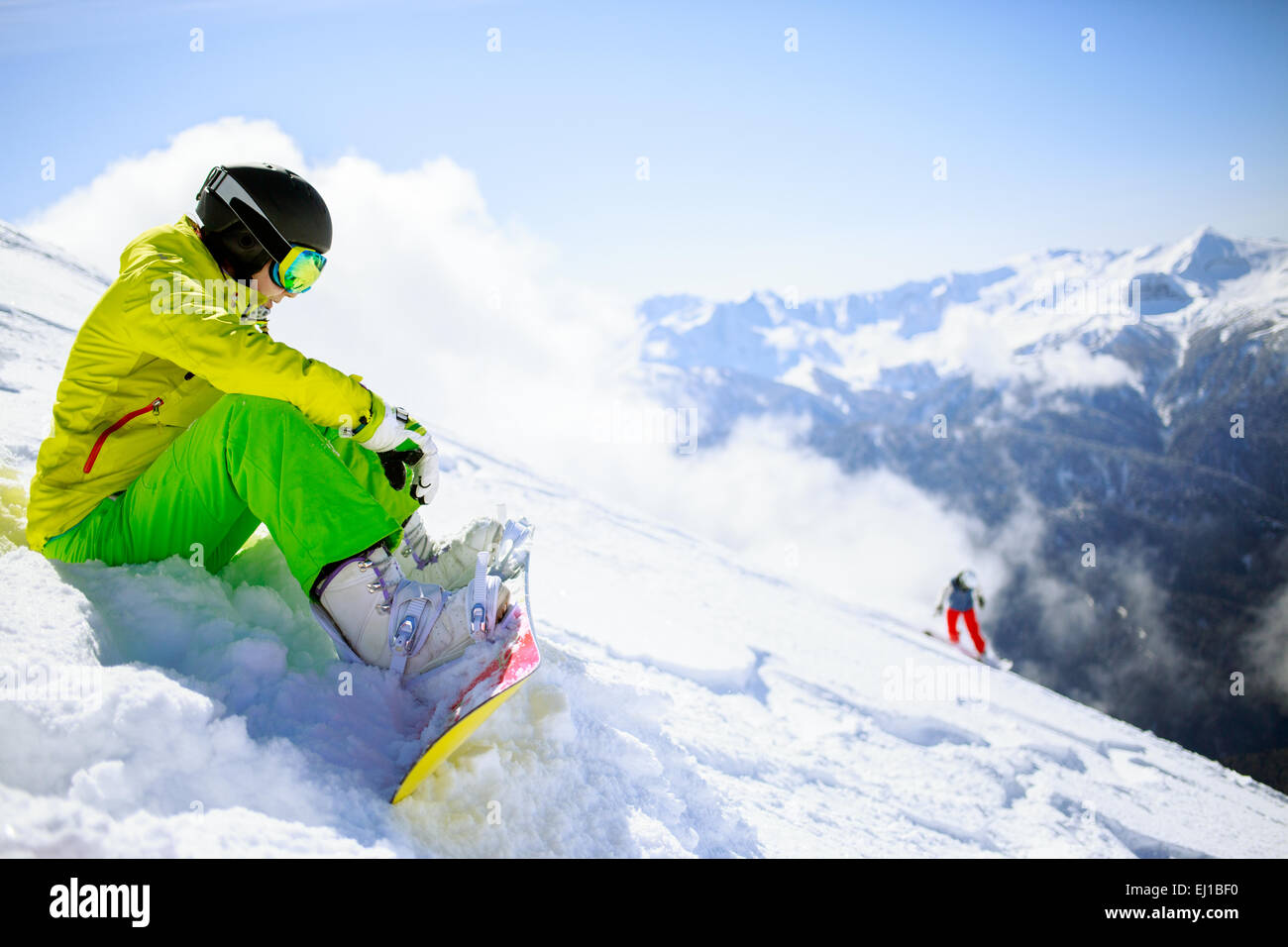 Snowboarder sitting snow slope hi-res stock photography and images - Alamy