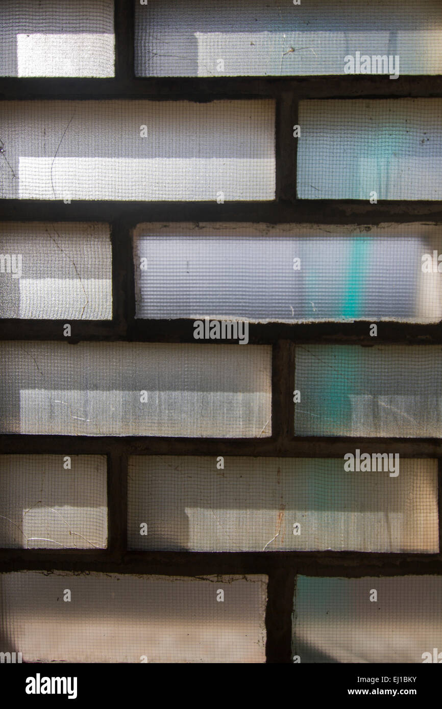 Light crosses through small rectangle windows of a building Stock Photo ...