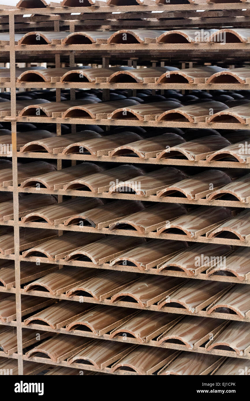 Close up view of a pile of traditional mud roof tile production Stock ...