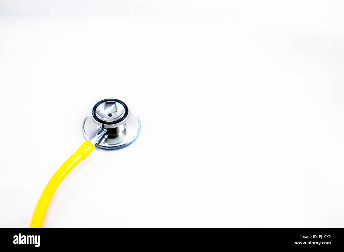 Yellow stethoscope with isolated white Stock Photo - Alamy