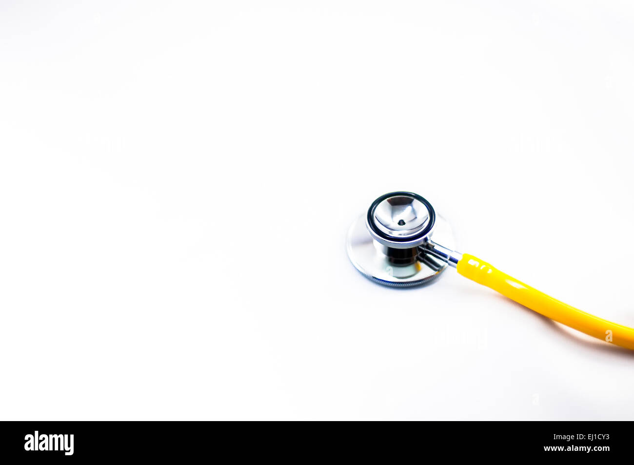 Yellow stethoscope with isolated white Stock Photo - Alamy