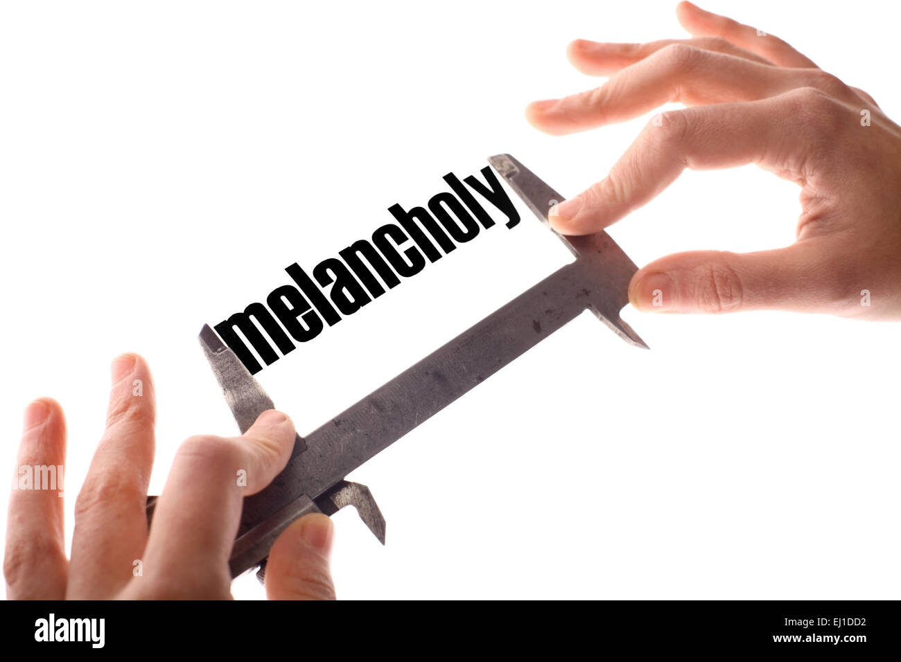 Color horizontal shot of two hands holding a caliper measuring the word ...