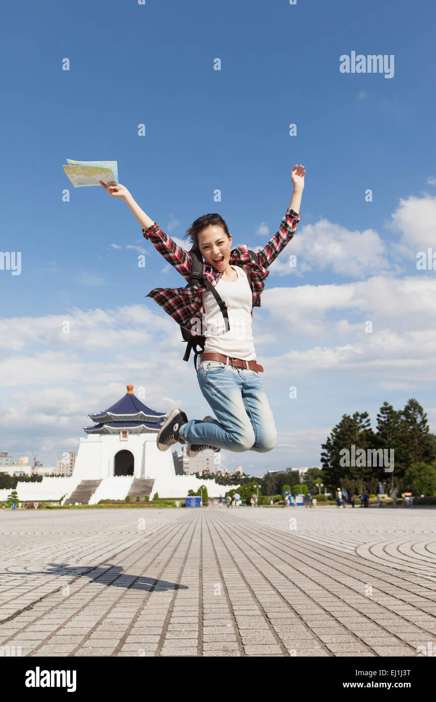 Young woman jumping happily hi-res stock photography and images - Alamy