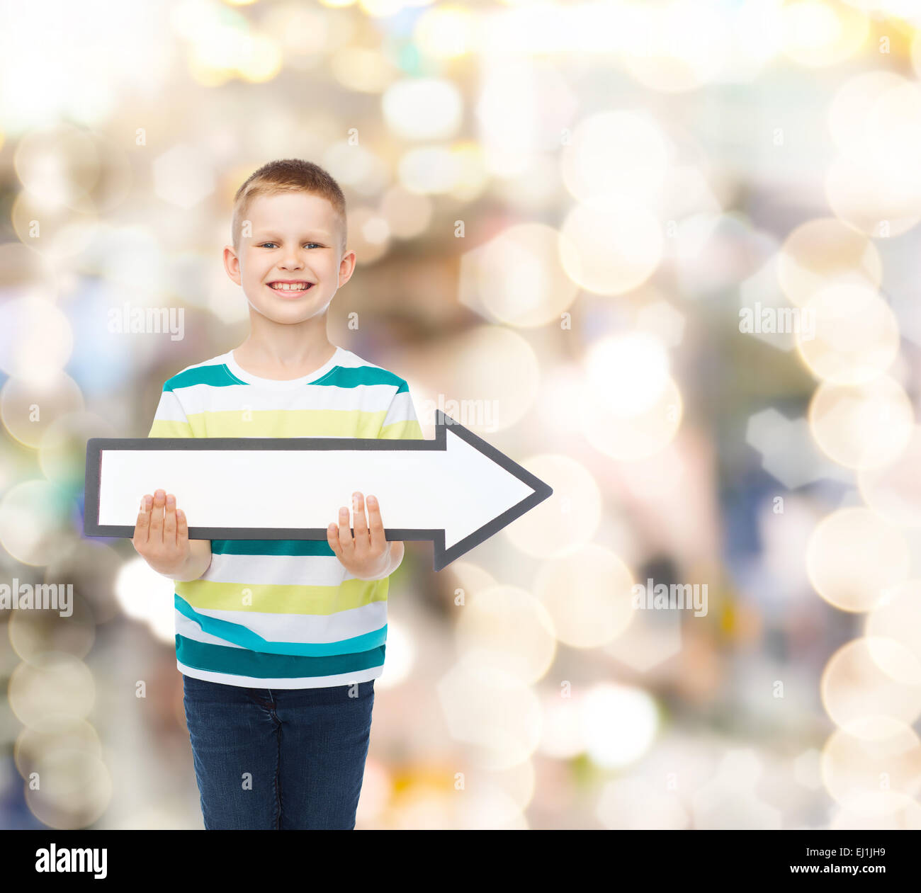smiling little boy with blank arrow pointing right Stock Photo - Alamy